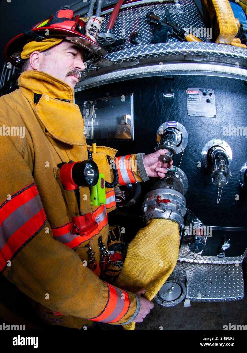 Firefighter in turnout gear Stock Photo - Alamy