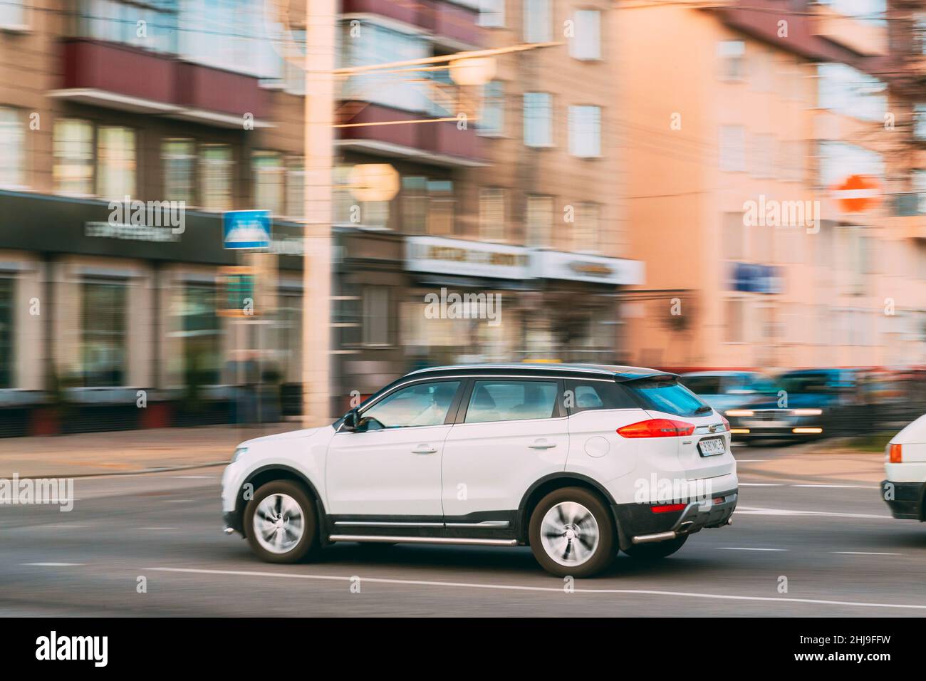 White Geely Boyue (Geely Atlas) Car Fast Rides City Street. Side View ...