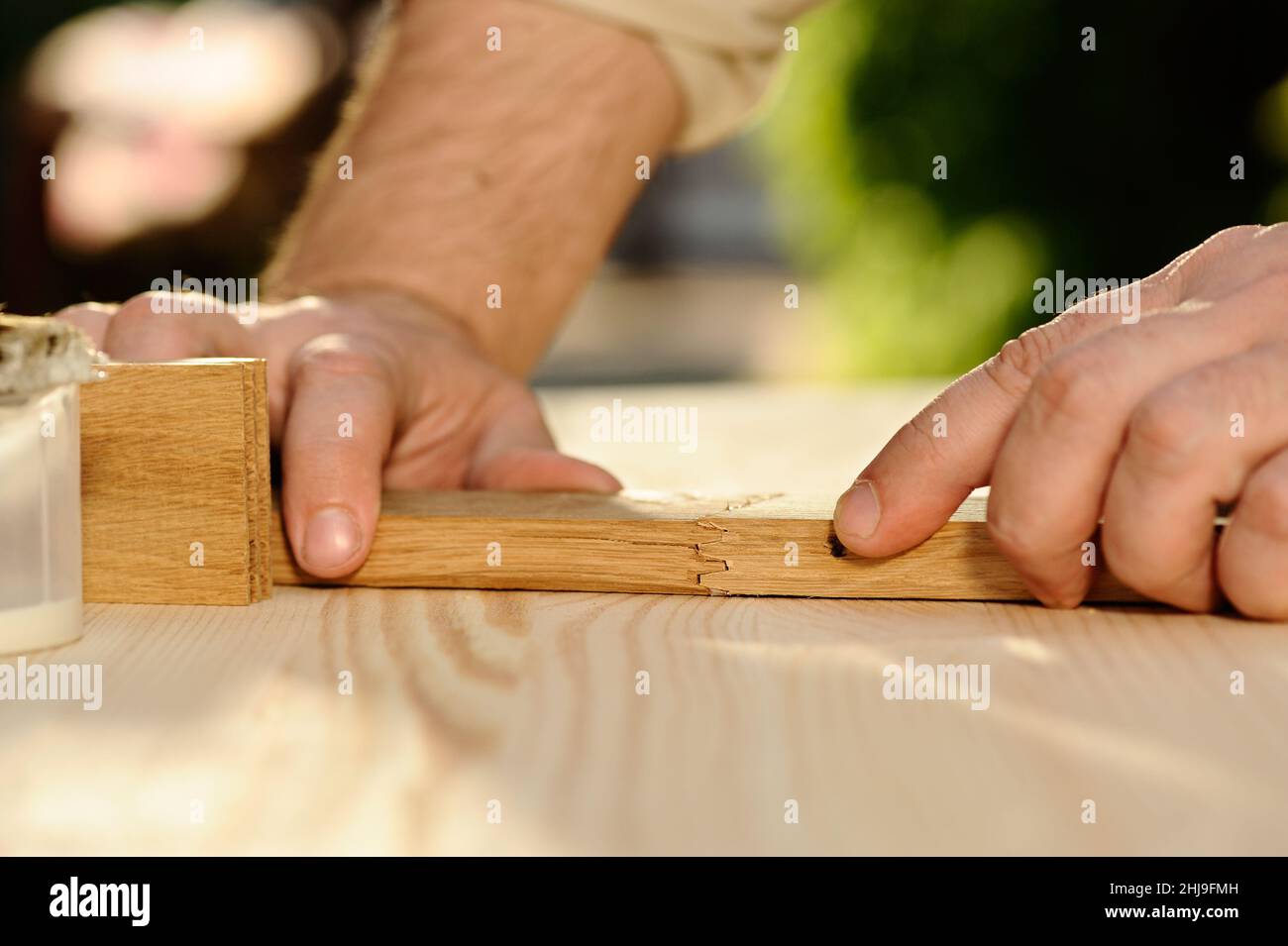 Carpenter's hands at work closeup Stock Photo - Alamy