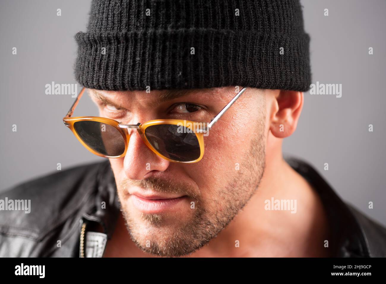 Brutal angry gang man lifestyle, serious handsome guy. Close up ...