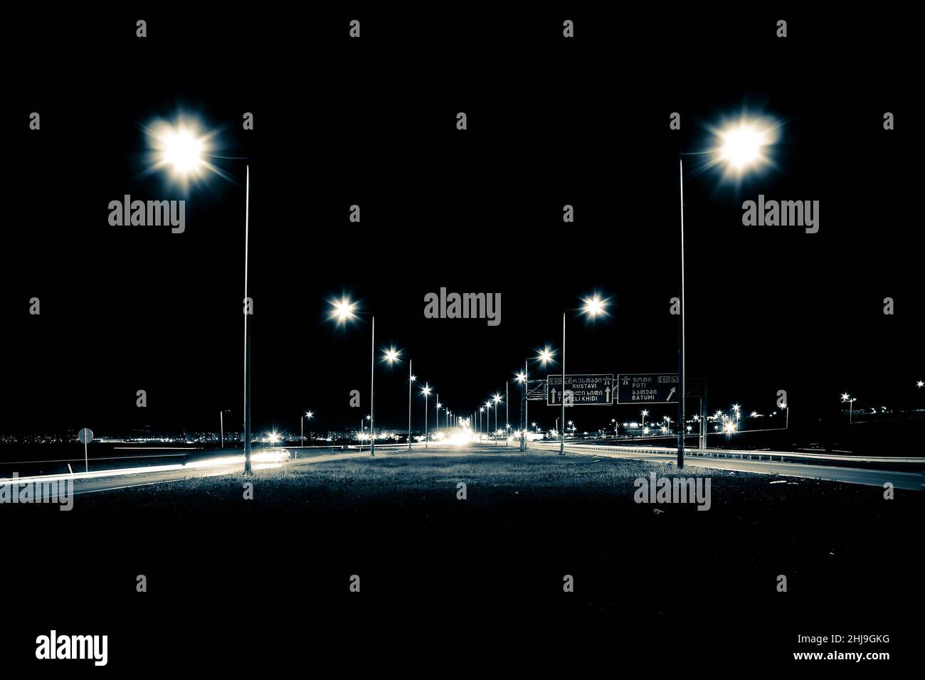 Empty freeway at night in blue monochrome Stock Photo - Alamy