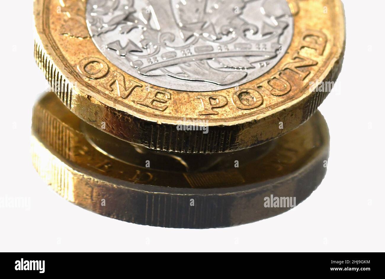 Close up of a one pound coin isolated on a plain white background with ...