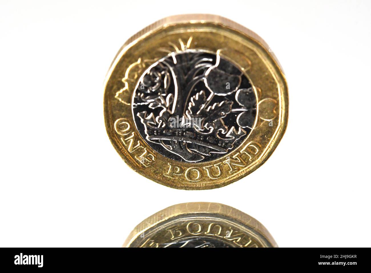 Close up of a one pound coin isolated on a plain white background with ...