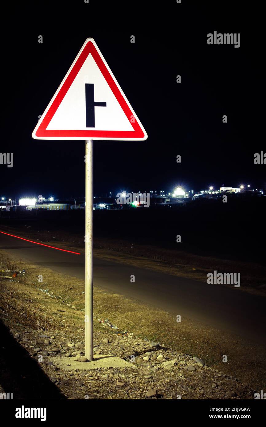 Road sign at night Stock Photo - Alamy