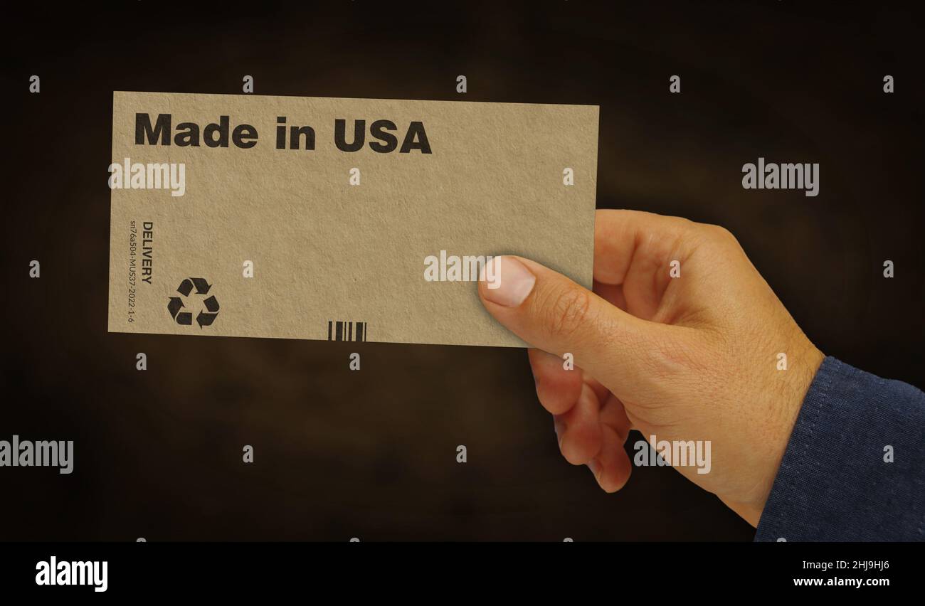 Made in USA box in hand. Manufacturing and delivery. Product factory ...