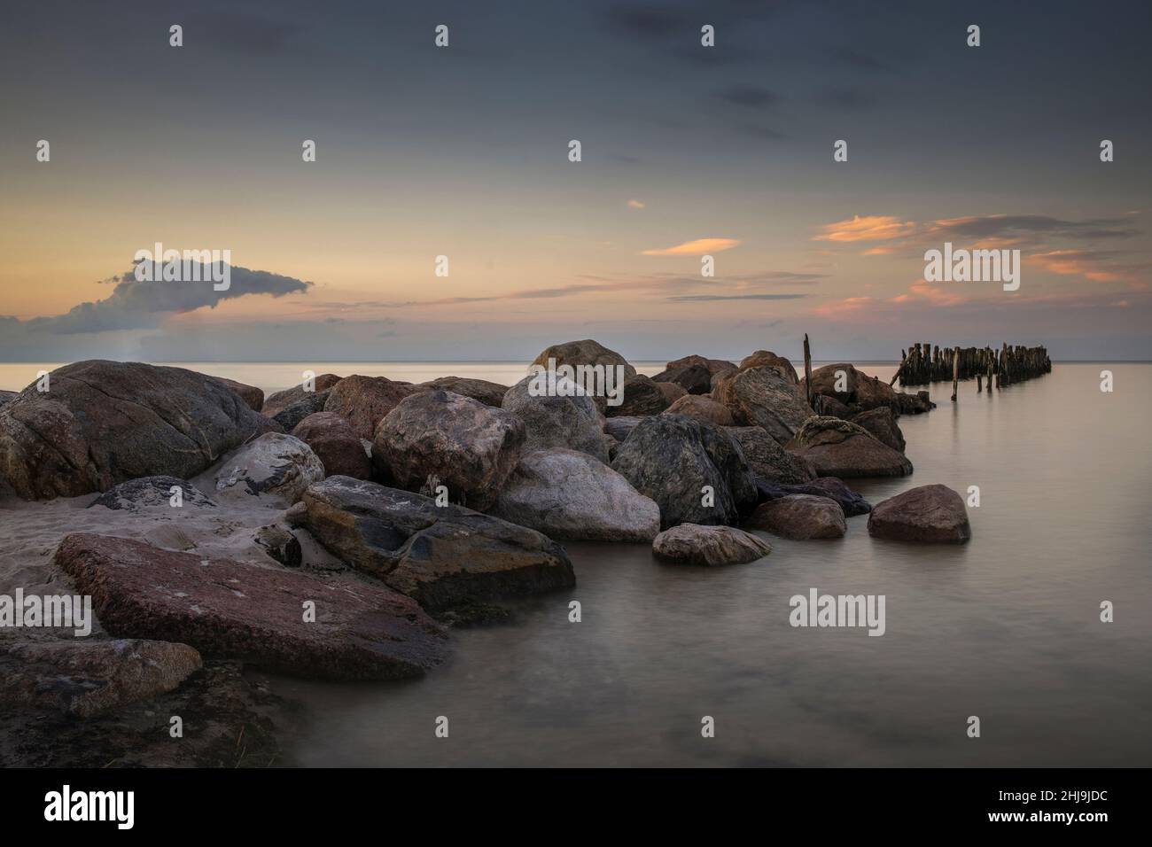 An old sea port mole built of large boulders. Latvia city Engure Stock ...