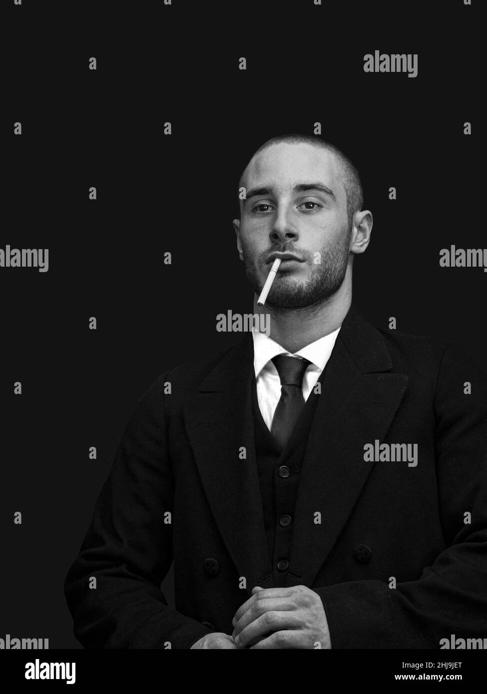 Elegant man who smokes, isolated on black background , Mafia face Stock ...