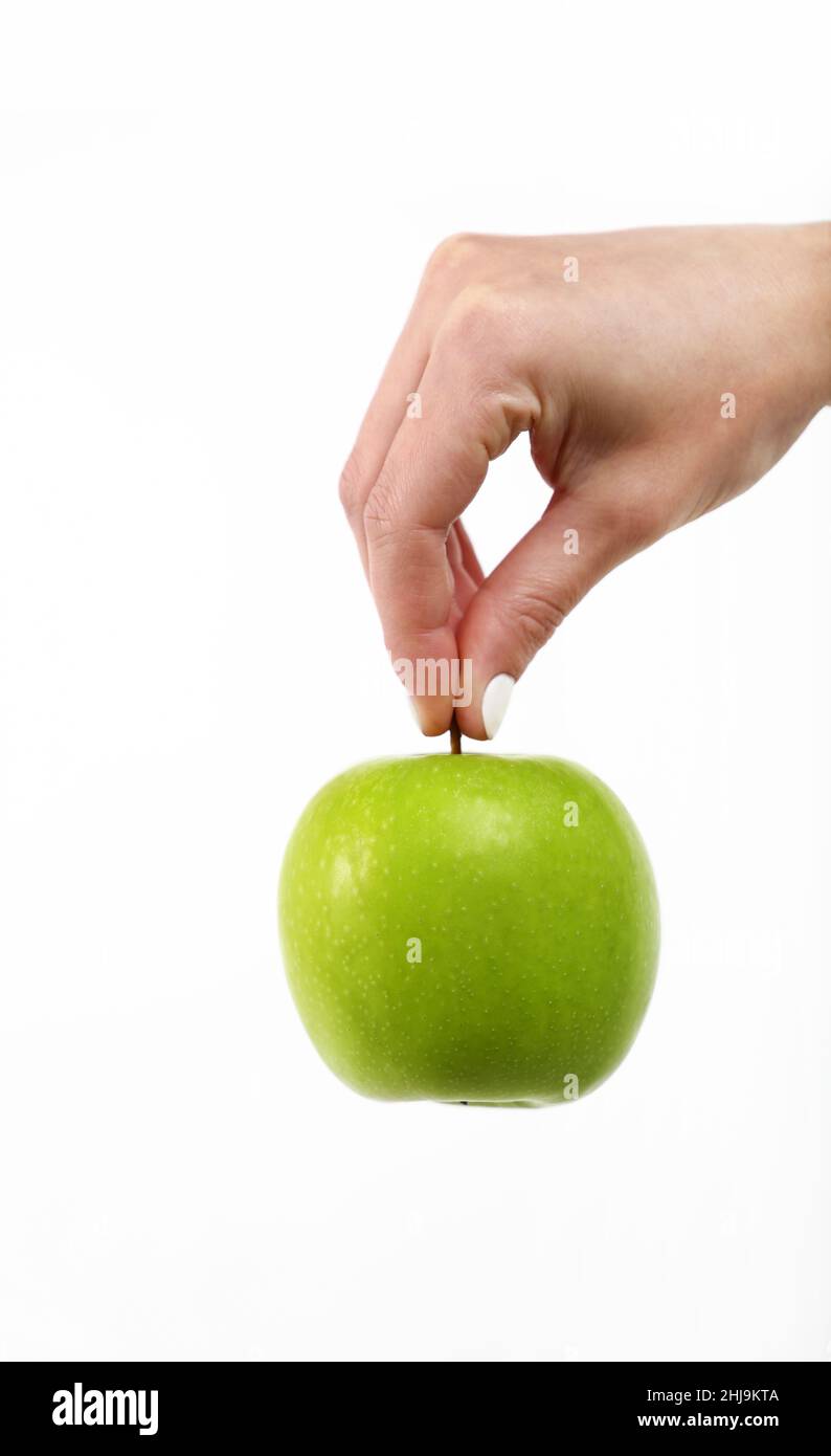 Close up Caucasian woman hand holding one fresh green apple isolated on ...