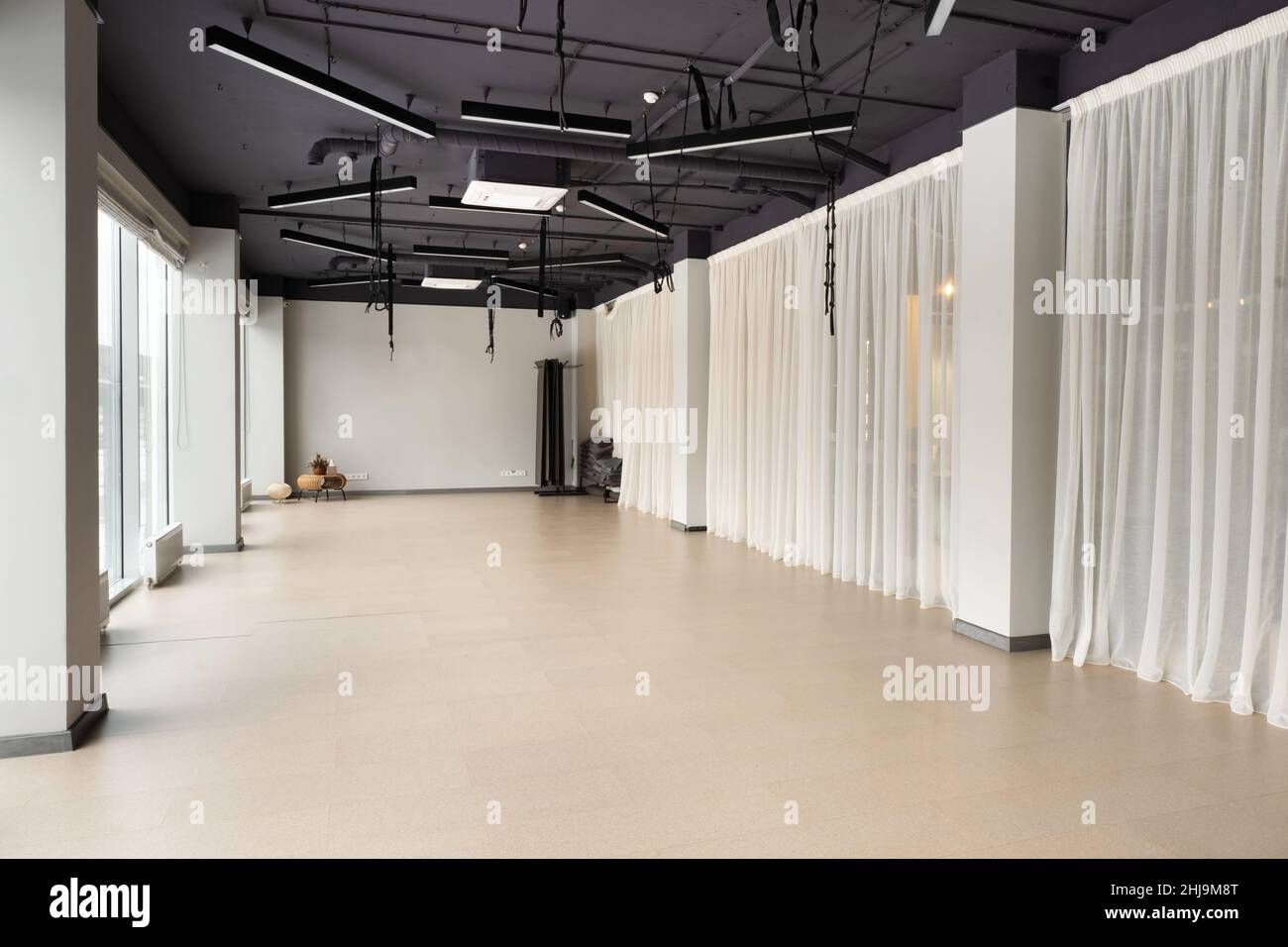 Large gym for fitness classes with large windows Stock Photo - Alamy