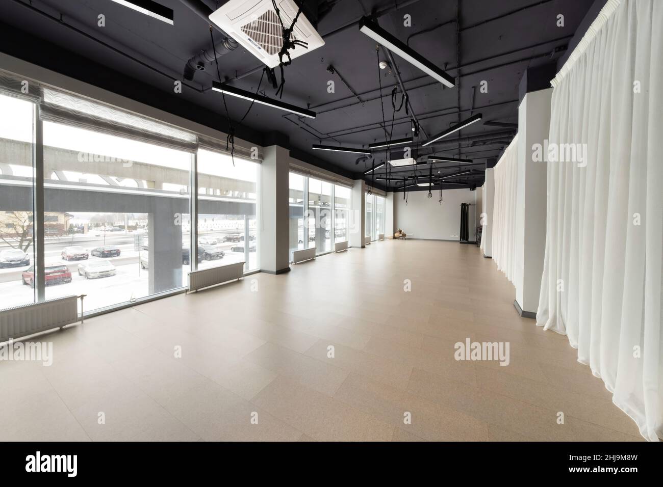 Large gym for fitness classes with large windows Stock Photo - Alamy