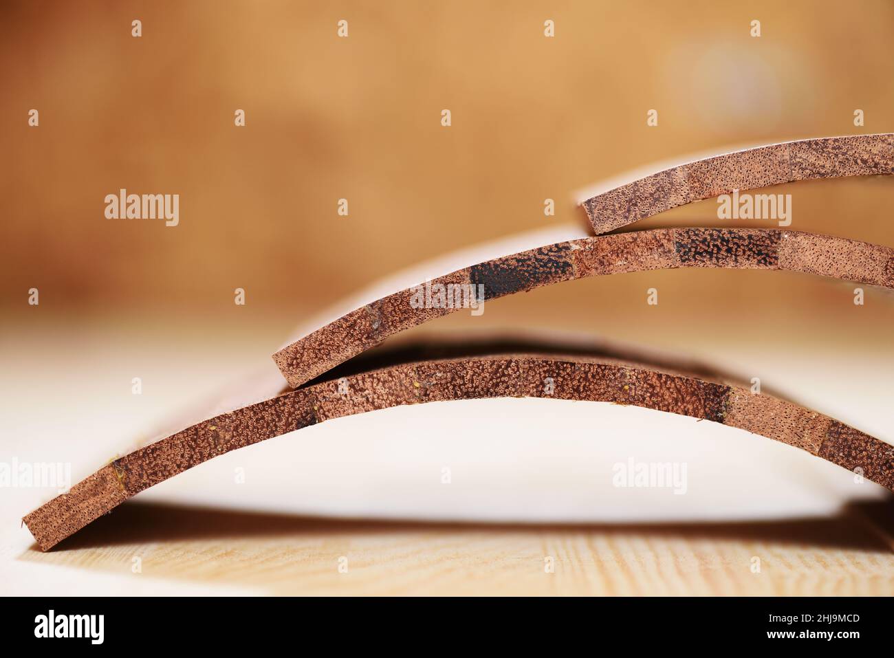 Curved merbau wood parts for handmade drum closeup Stock Photo - Alamy