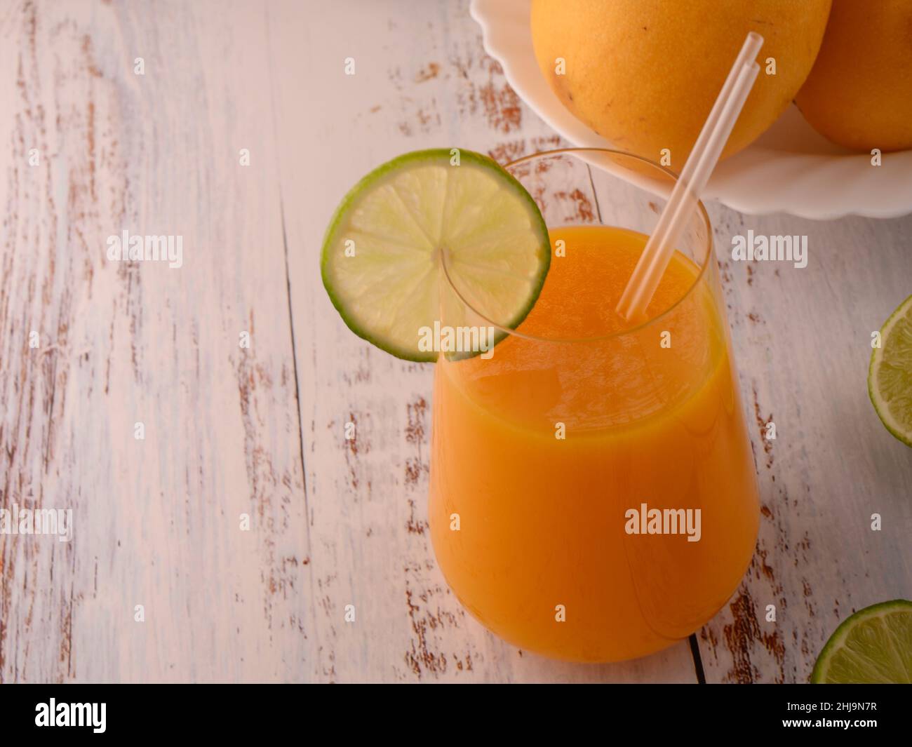 Photo shows glass transparent with natural fresh mango juice closeup on ...