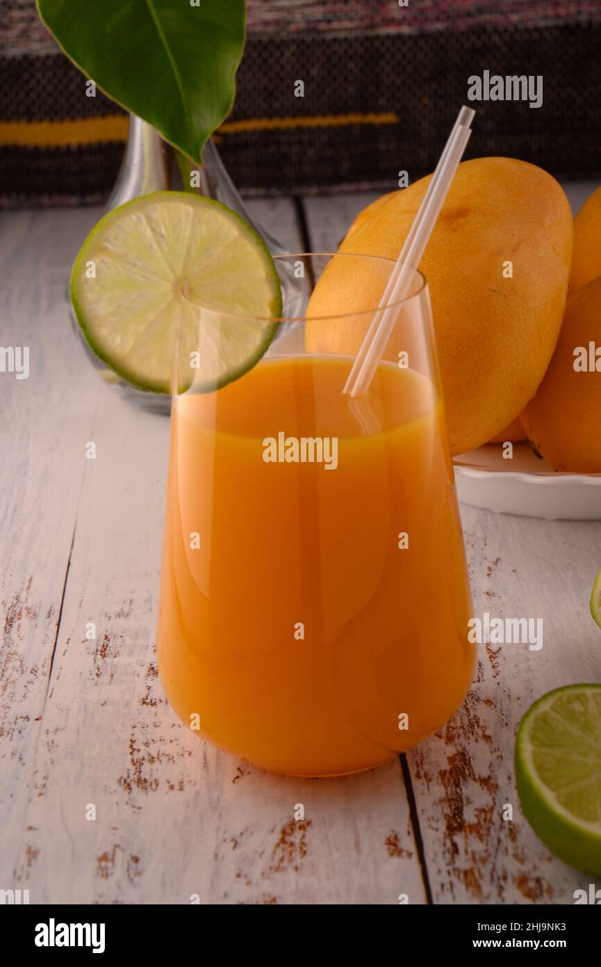 Photo shows glass transparent with natural fresh mango beverage on ...