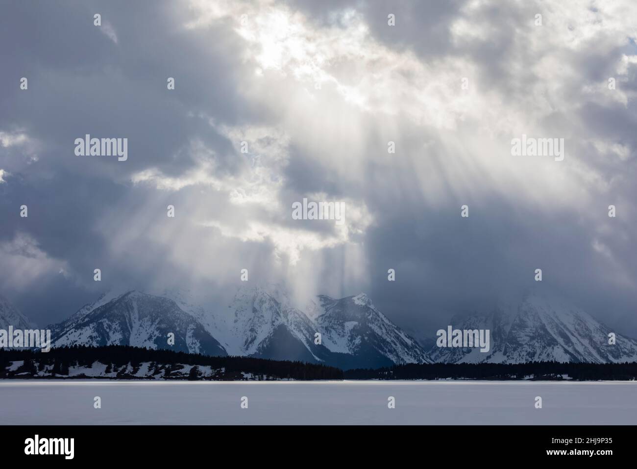 Dramatic view of the peaks of the Grand Teton Range over Jackson Lake ...