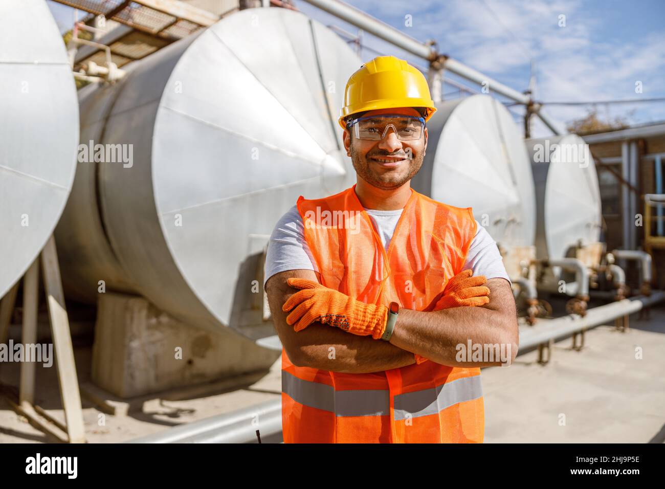 Smiling factory worker standing hi-res stock photography and images - Alamy