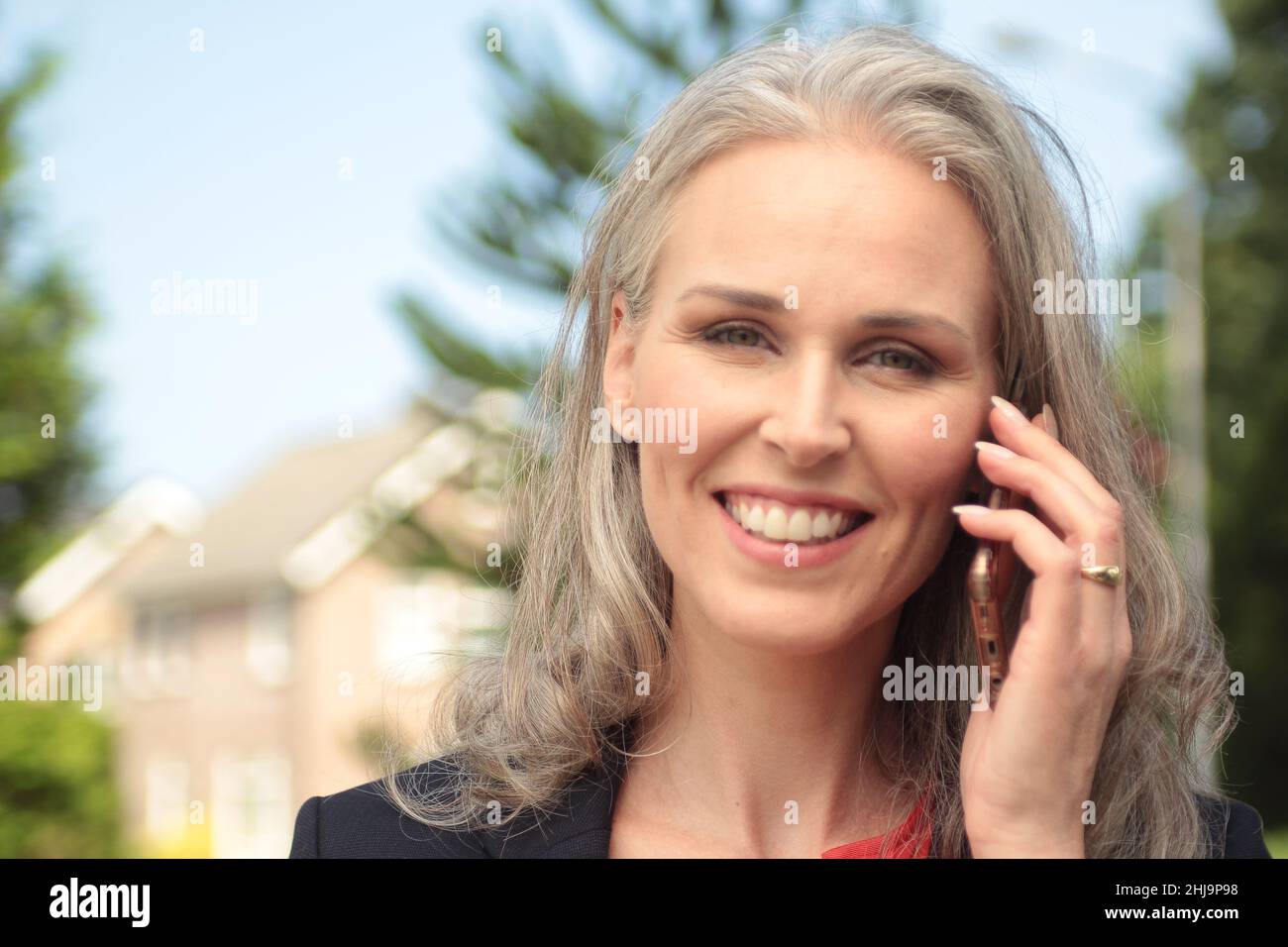 Beautiful woman being outside in the park Stock Photo - Alamy