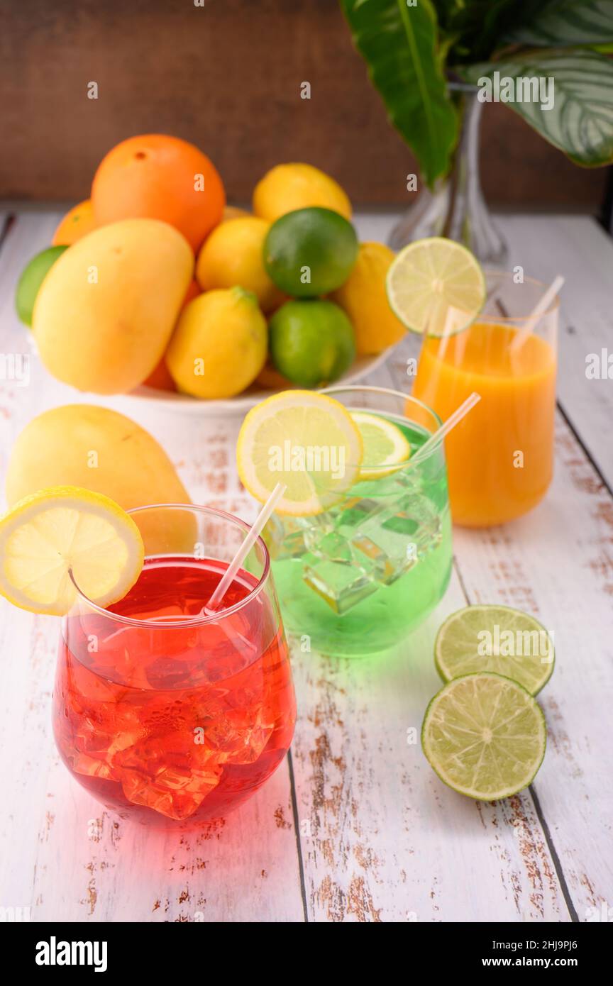 Photo shows varios fresh fruits such as mangoes, lemons, limes and ...