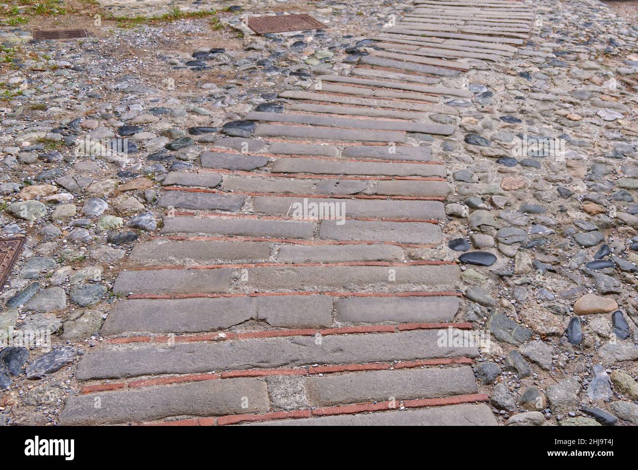 a medieval path tiled with stones Stock Photo - Alamy