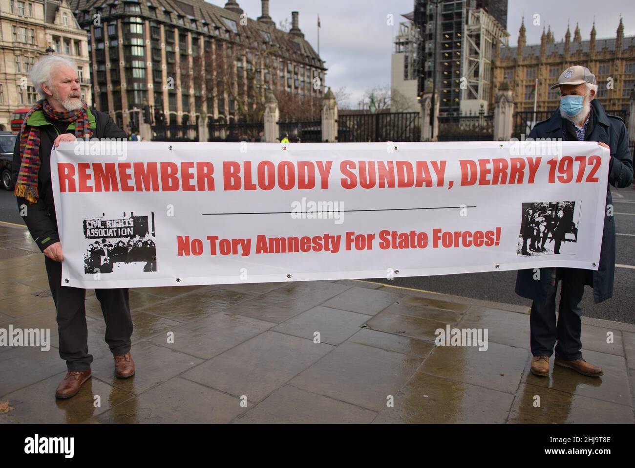 Demonstrators hold a 'Remember Bloody Sunday' banner during the rally ...