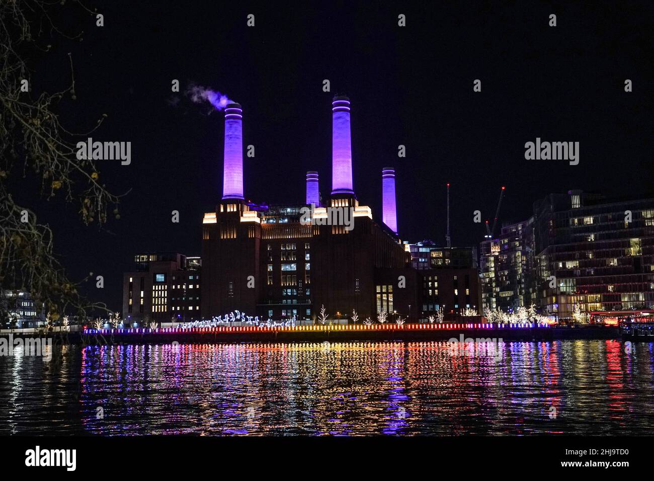 A view of Battersea Power Station in London, lit up in purple for ...