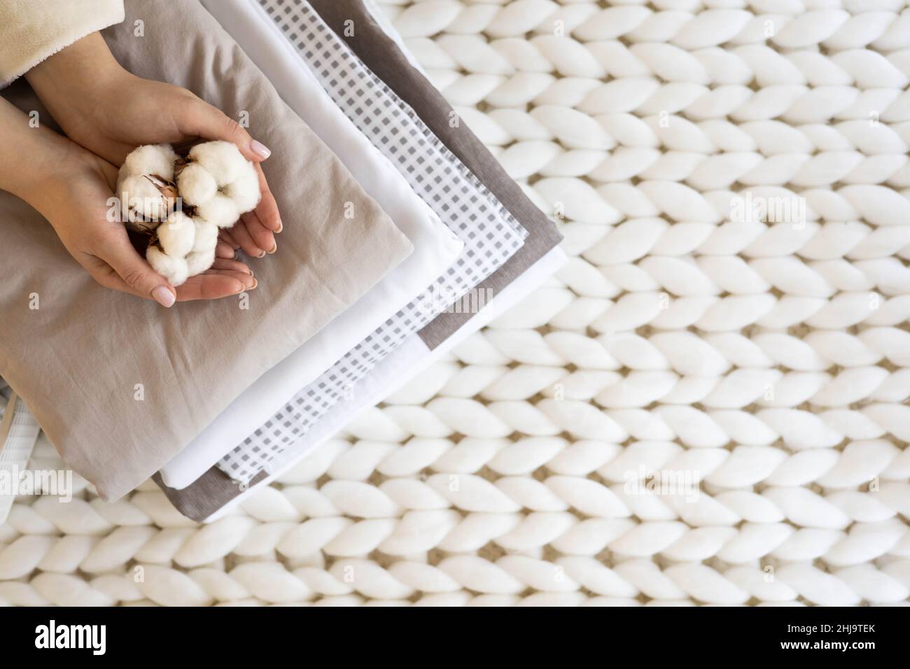 Stack of folded warm blankets with different design patterns and cotton ...