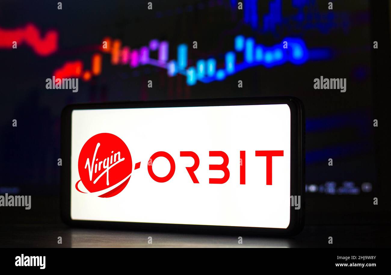In this photo illustration, a Virgin Orbit Holdings logo seen displayed ...