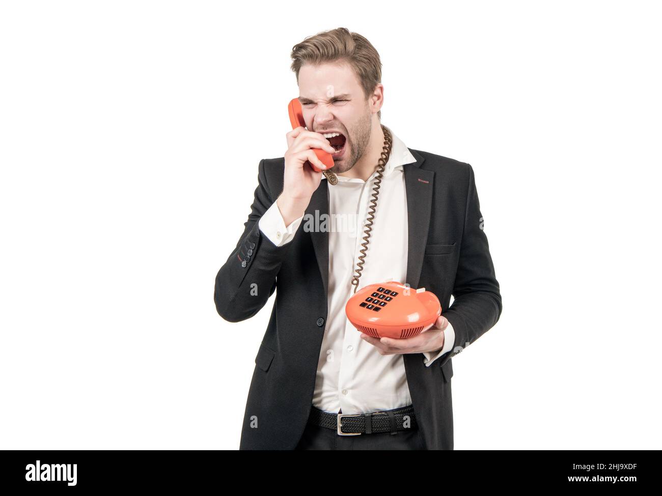 Angry man employee in suit shout in anger to telephone receiver being ...