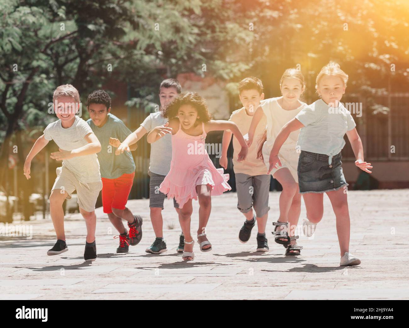 Happy children running in race and laughing outdoors Stock Photo - Alamy