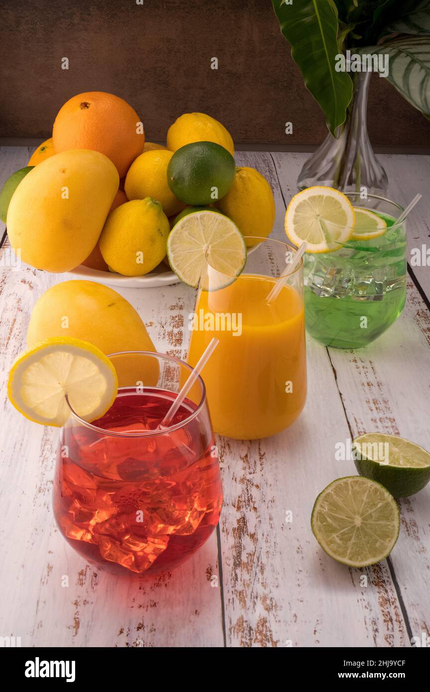 Photo shows varios fresh fruits such as mangoes, lemons, limes and ...