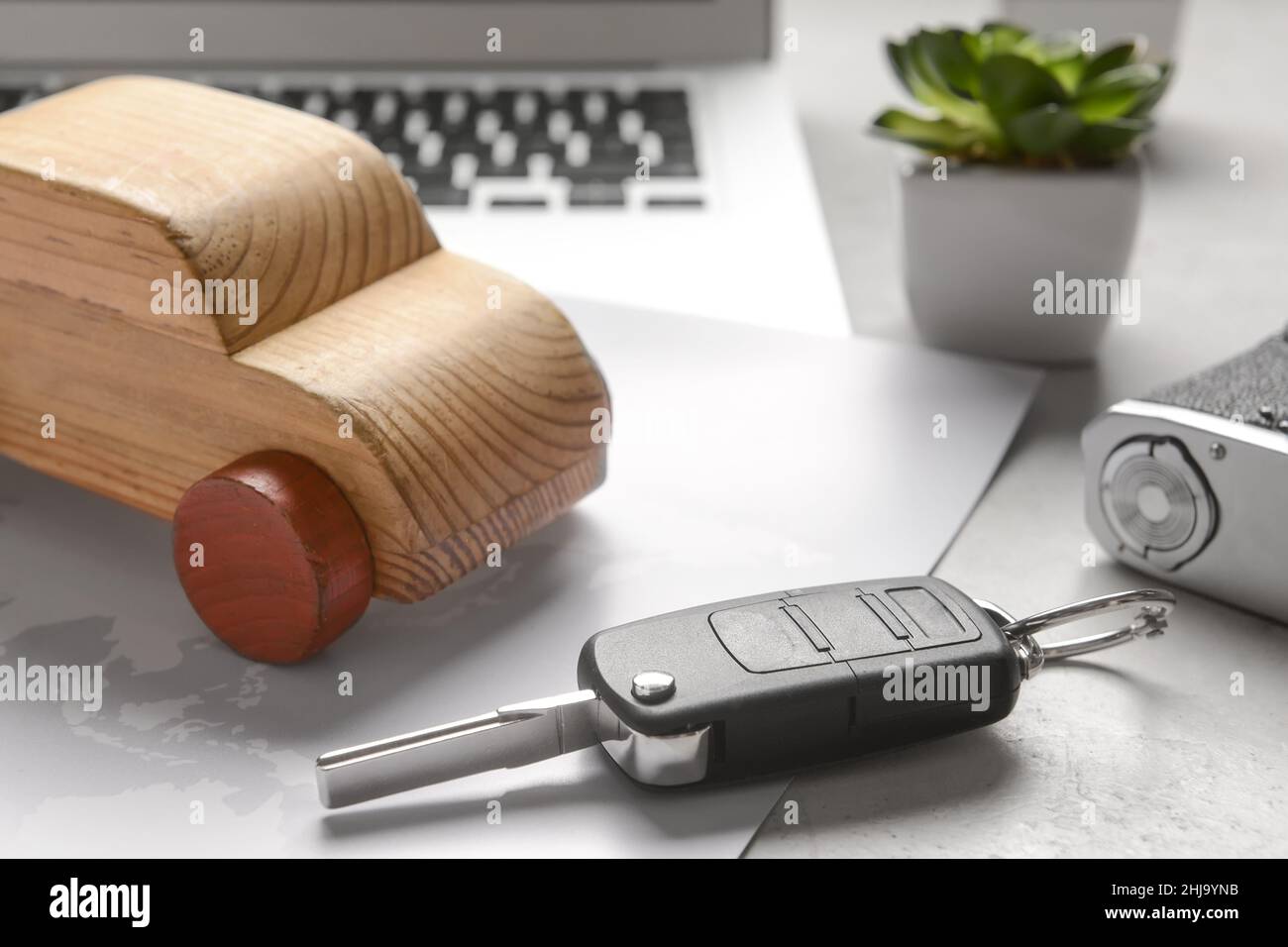 Wooden car with key and map on white background, closeup Stock Photo ...
