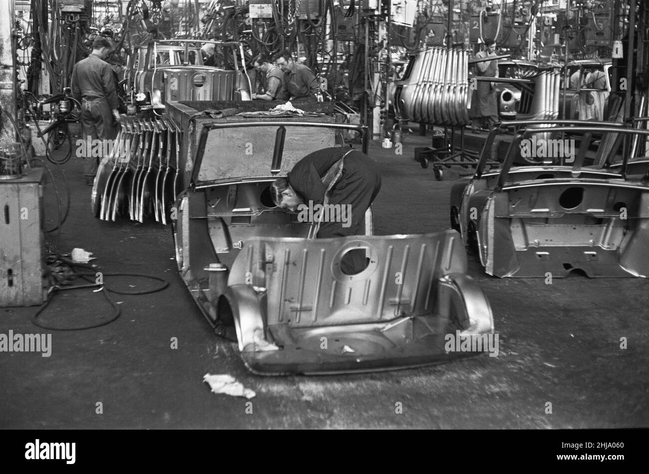 Austin Mini body panels are assembled prior to welding and being placed ...