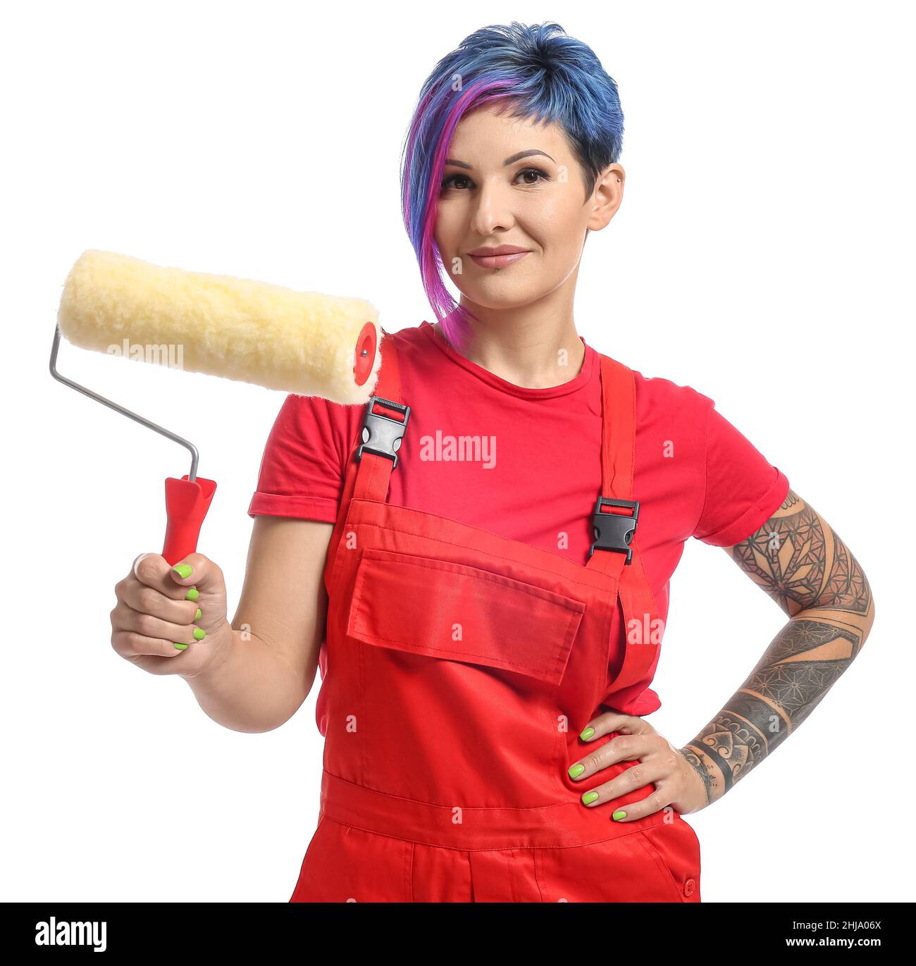 Female painter in red uniform with paint roller on white background ...