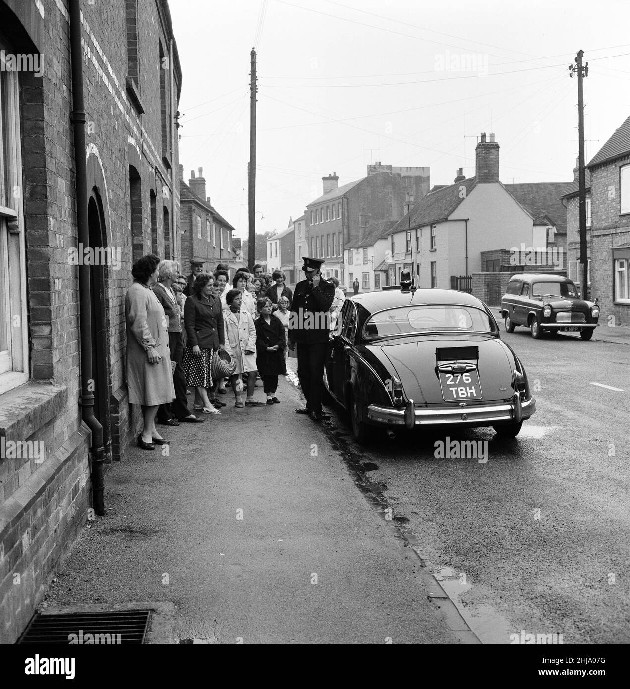 Police car equipped with a telephone loudspeaker unit, appeals for ...