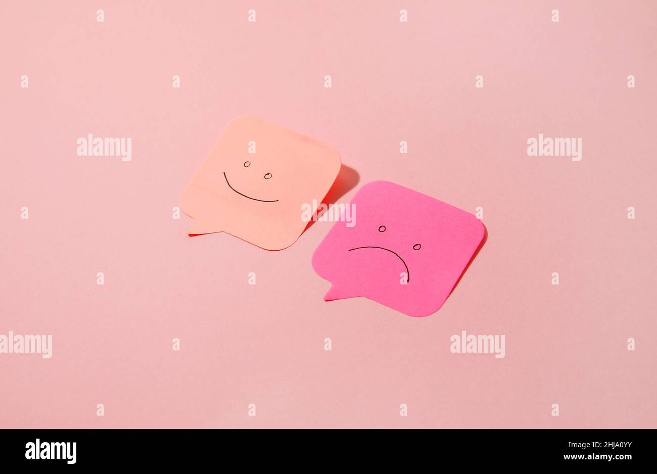 Sticky notes with drawn faces on pink background Stock Photo - Alamy