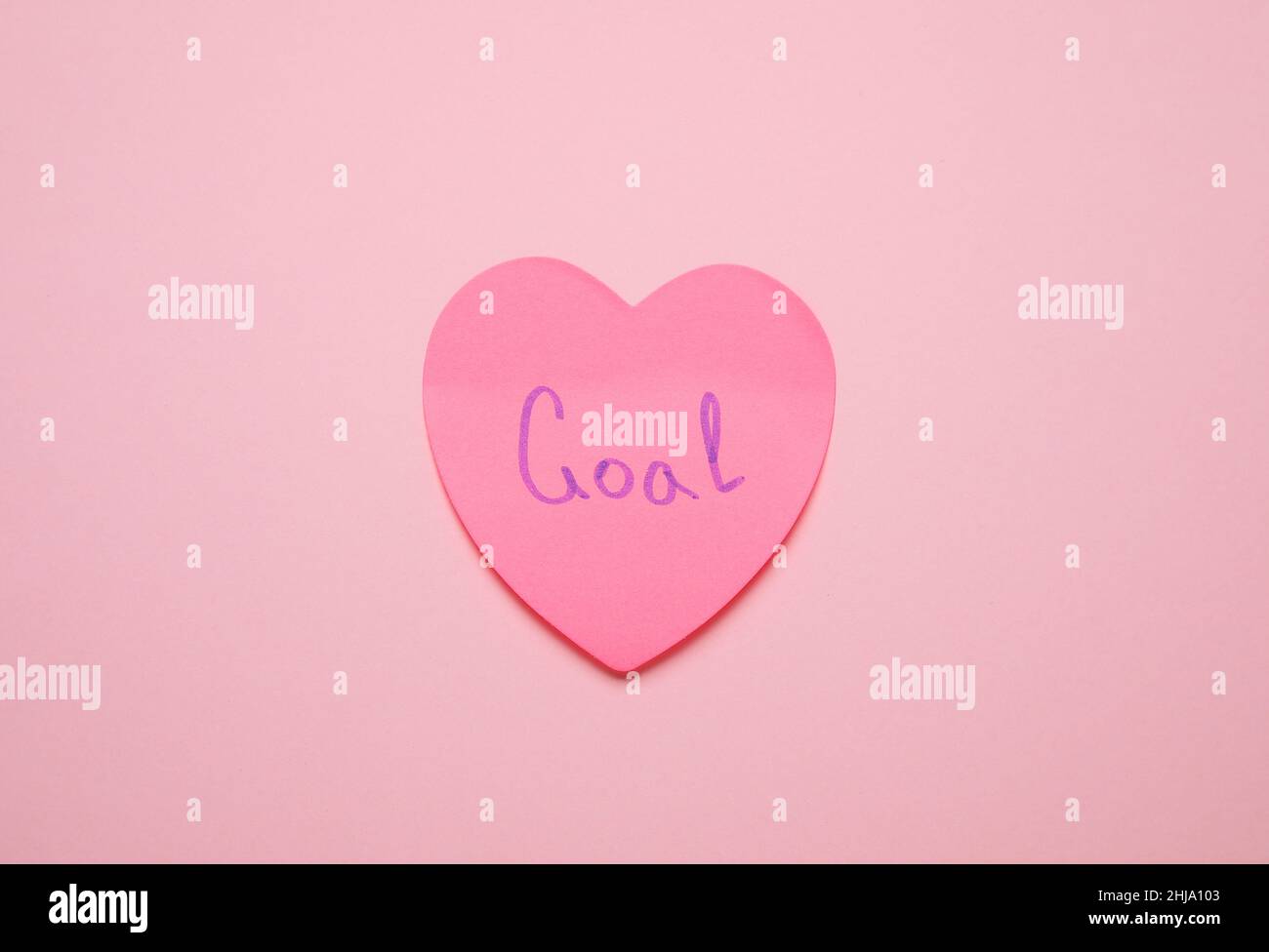 Heart shaped sticky note with word GOAL on pink background Stock Photo ...