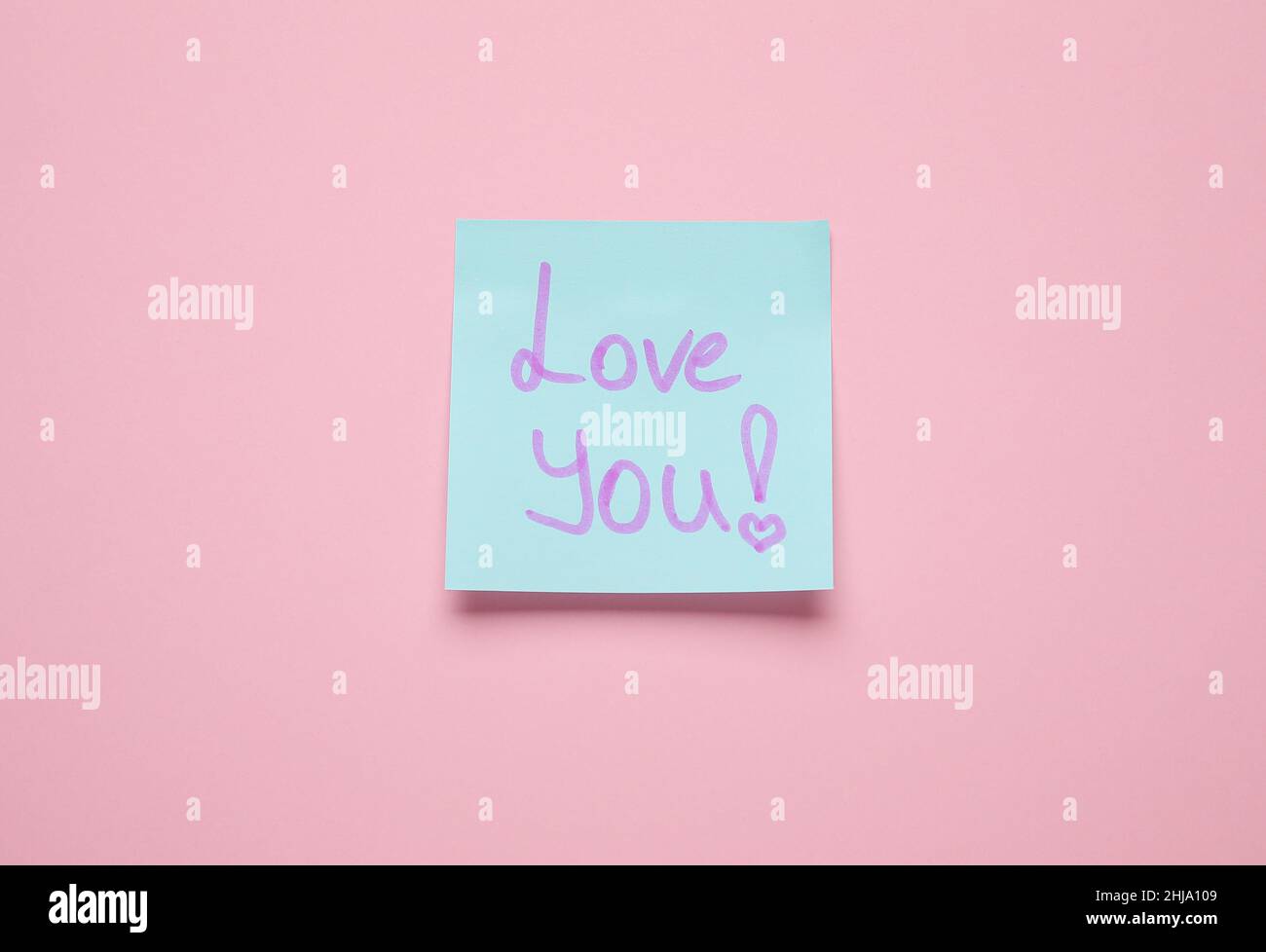 Sticky note with text LOVE YOU on pink background Stock Photo - Alamy
