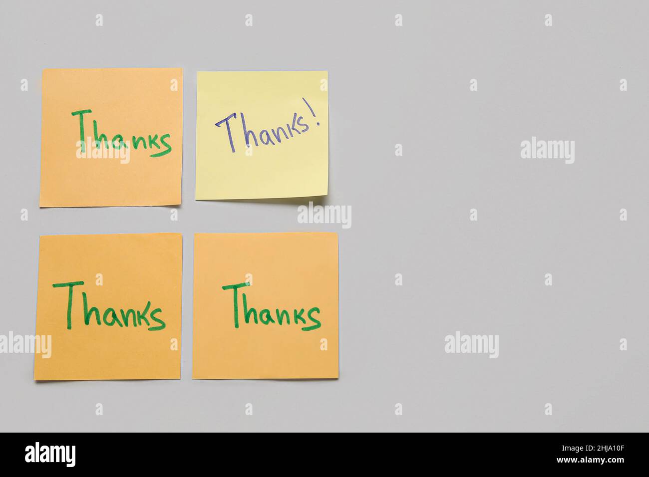 Sticky notes with word THANKS on grey background Stock Photo - Alamy