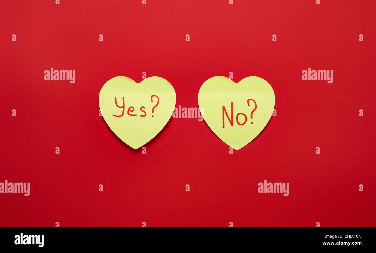 Sticky notes with questions YES and NO on red background Stock Photo ...