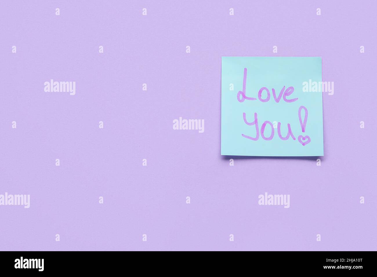 Sticky note with text LOVE YOU on violet background Stock Photo - Alamy