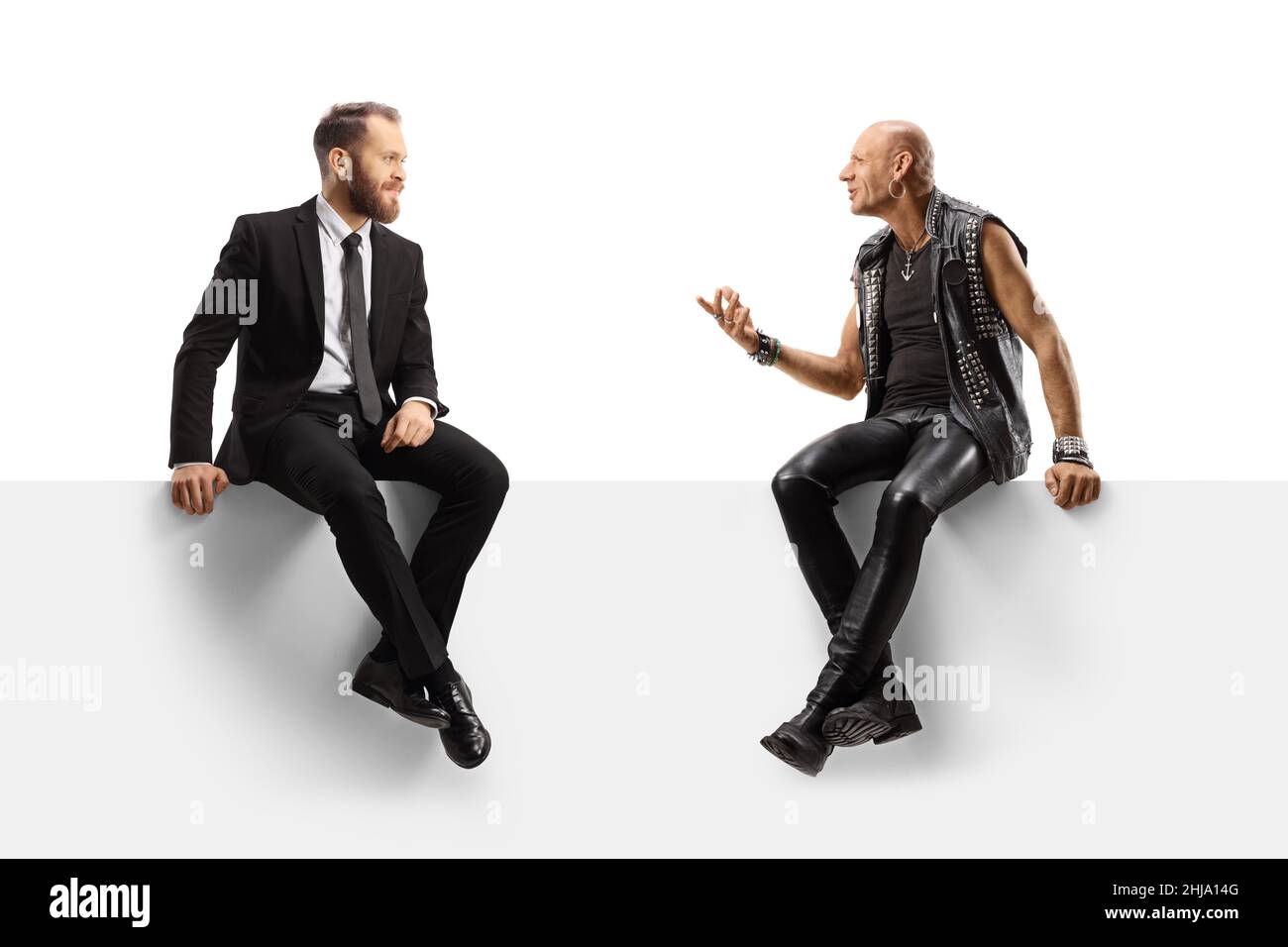 Punk sitting on a panel gesturing with hand and talking to a ...