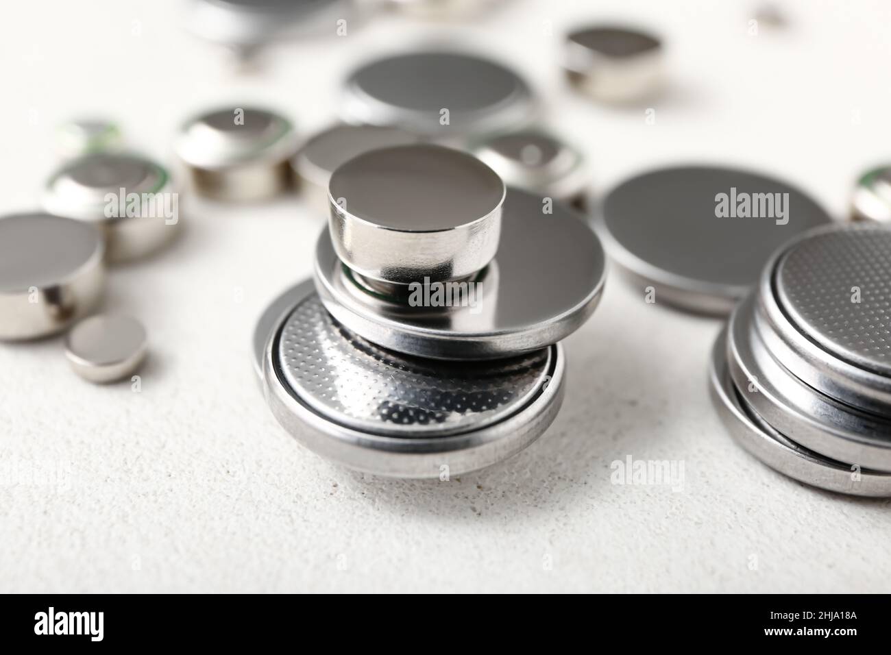 Metal lithium button cell batteries on white background, closeup Stock ...