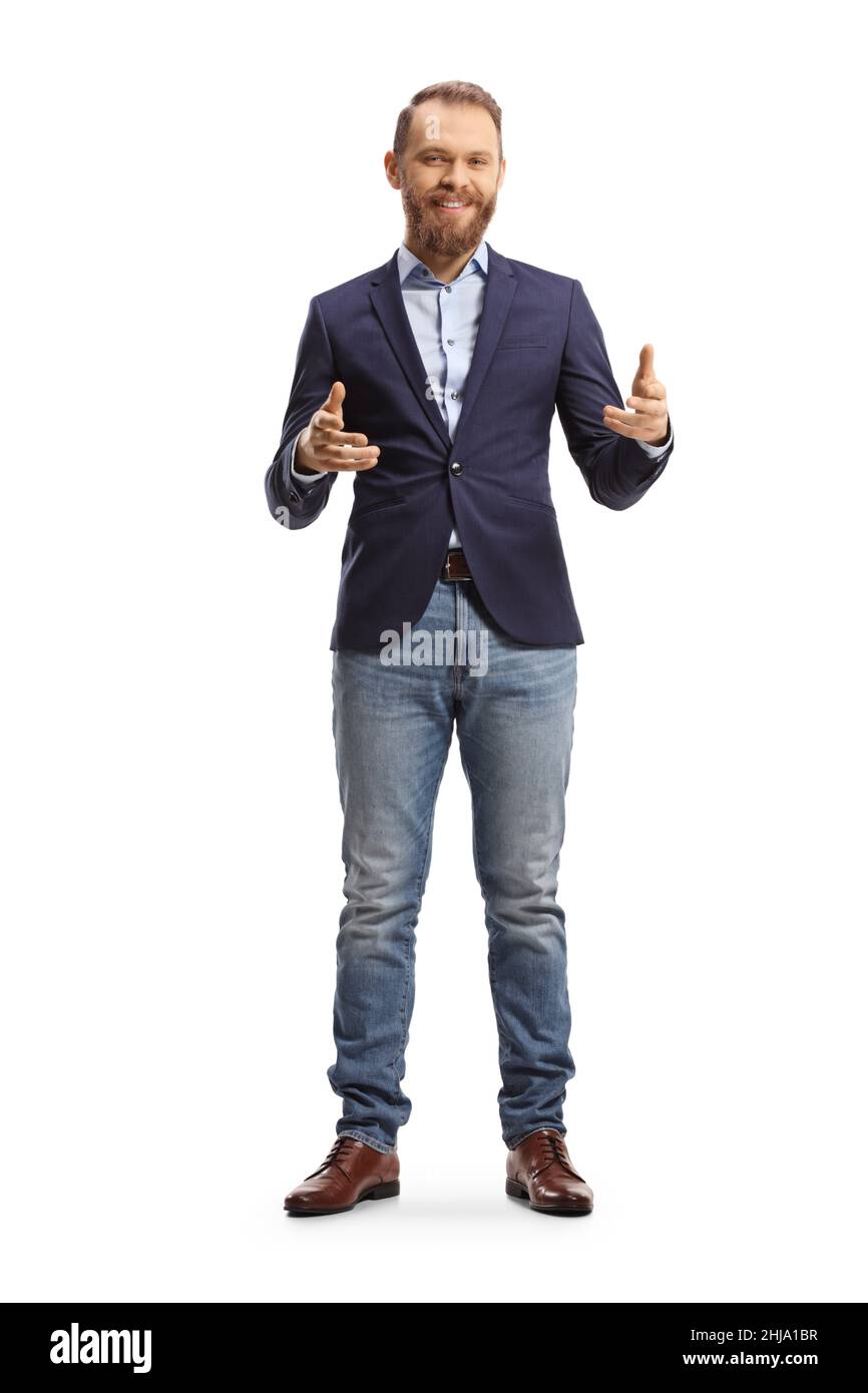 Full length portrait of a young man in suit and jeans smiling and ...