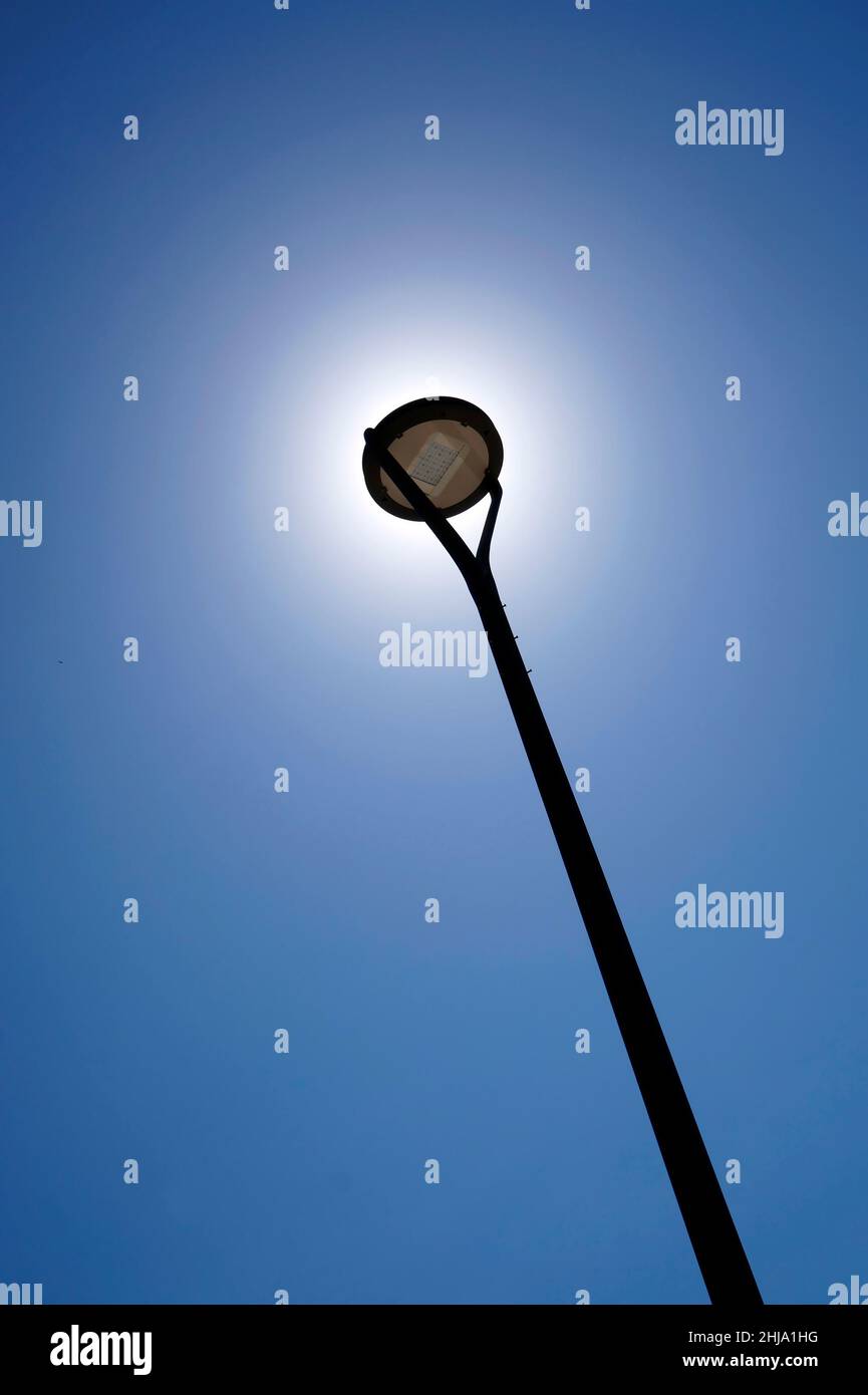 Light pole and sun light Stock Photo - Alamy