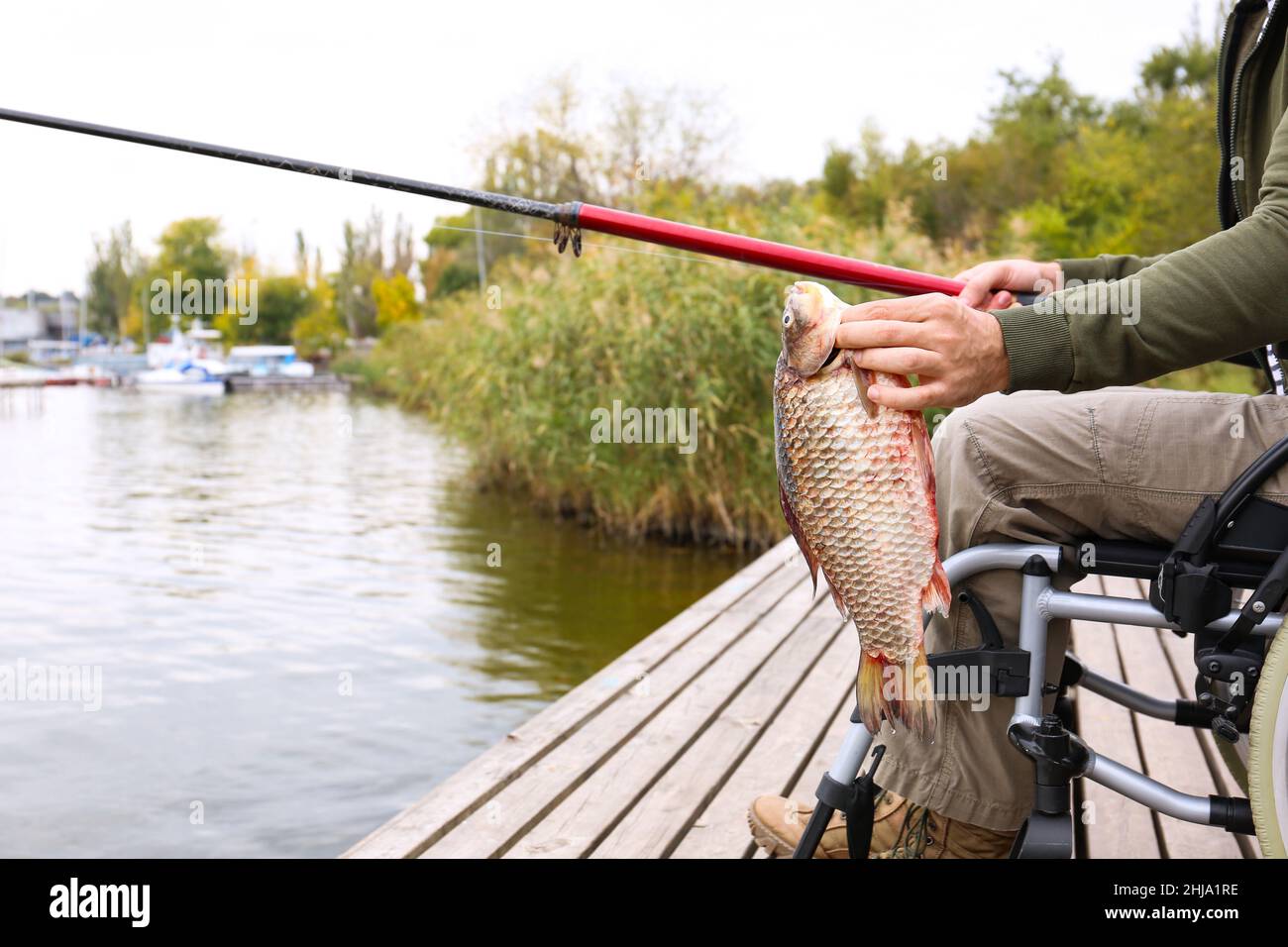 Person disability fishing hi-res stock photography and images - Alamy