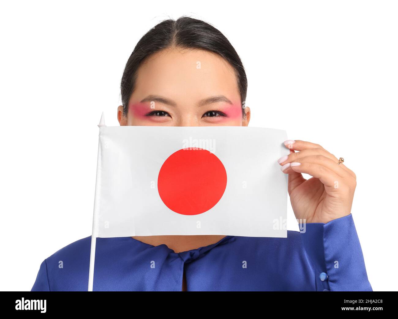 Beautiful young Asian woman with flag of Japan on white background ...