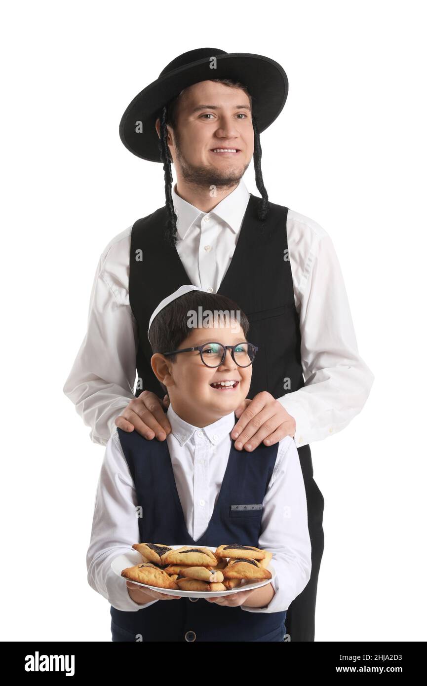 Jewish man and boy with tasty Hamantaschen for Purim holiday on white ...