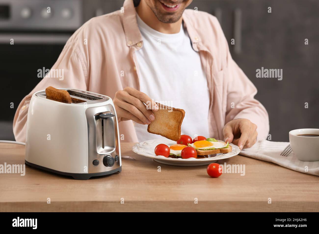 Eating slice of toast man hi-res stock photography and images - Alamy