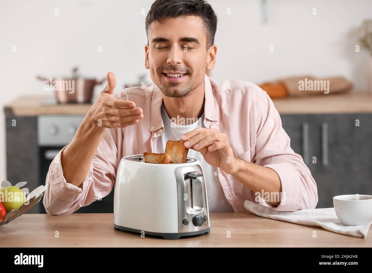 Man preparing tasty toasts hi-res stock photography and images - Alamy