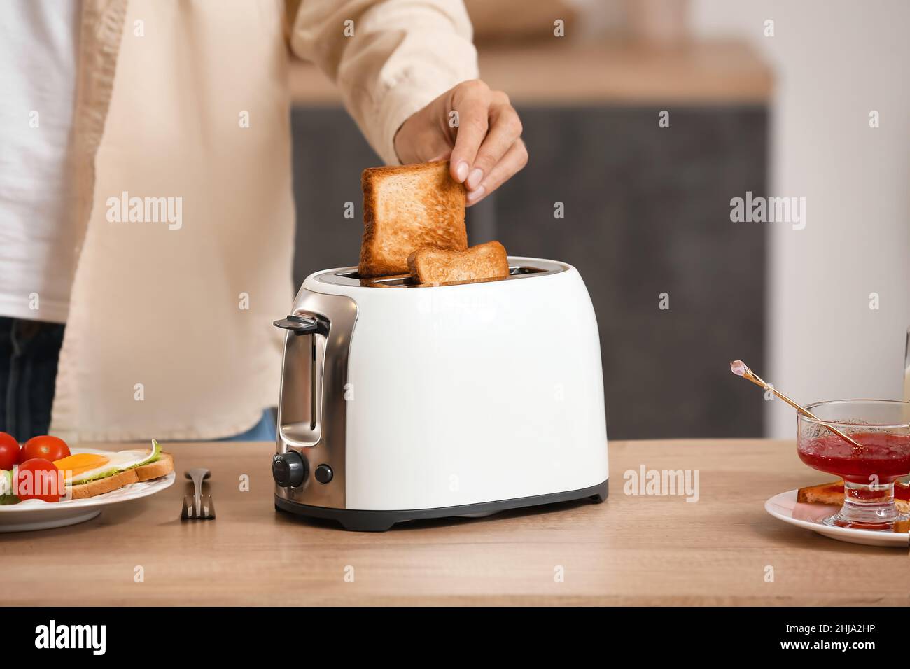 Man preparing tasty toasts hi-res stock photography and images - Alamy