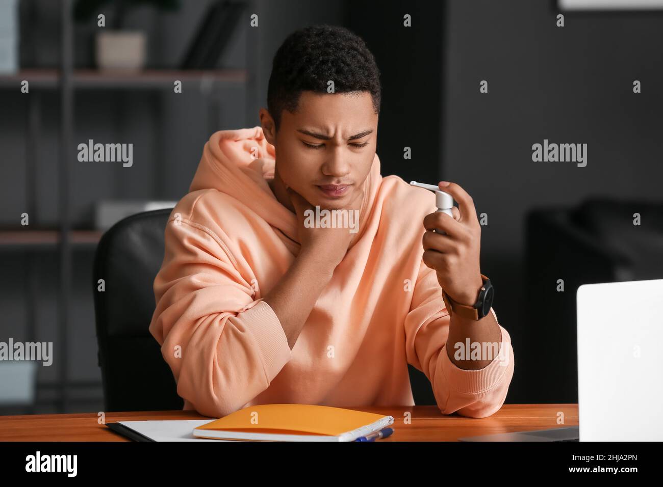 Ill African-American student with inhaler at home Stock Photo - Alamy
